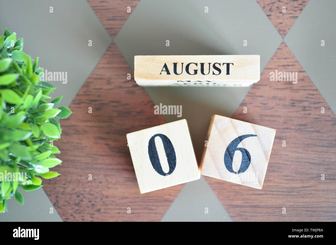 Date of August with leaf on diamond pattern table for background Stock ...
