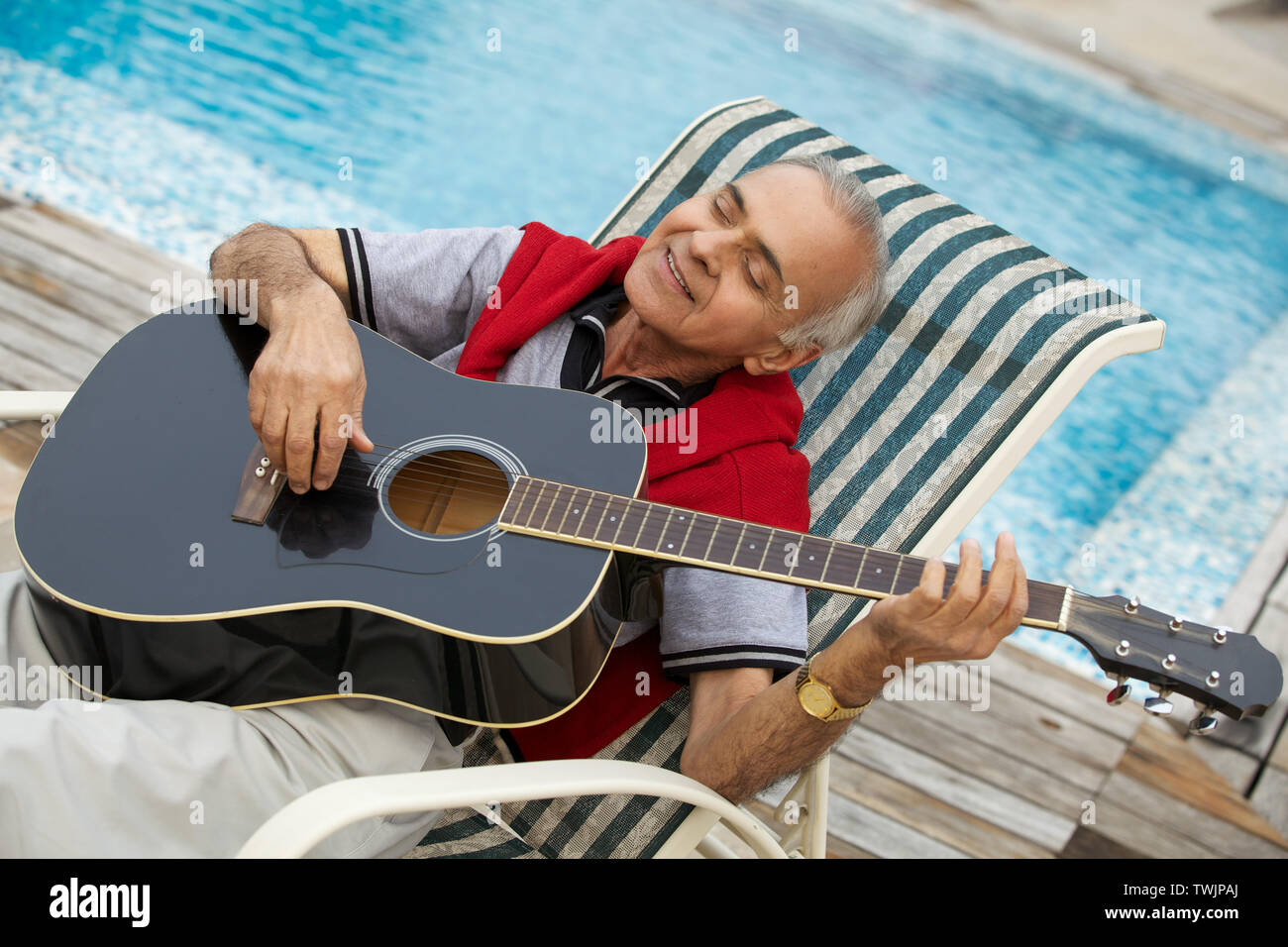 A senior citizen playing an instrument hi-res stock photography and ...