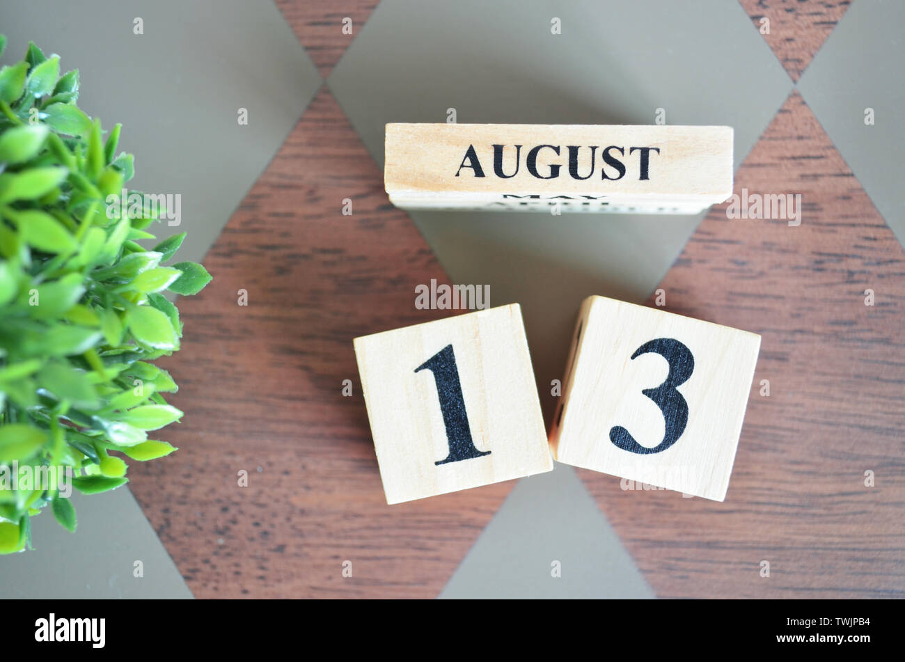 Date of August with leaf on diamond pattern table for background Stock ...