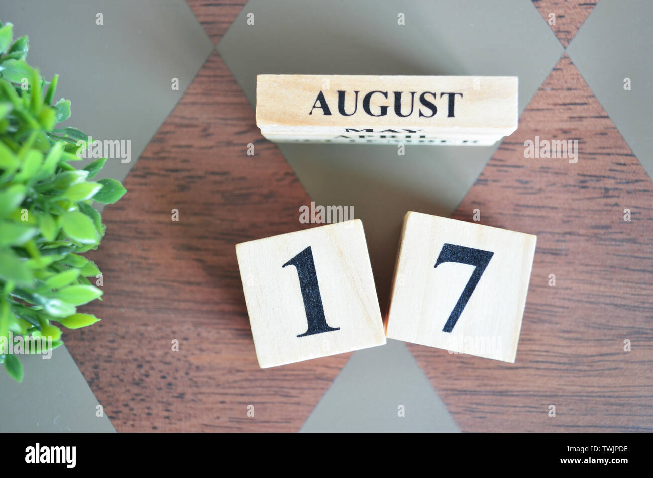 Date of August with leaf on diamond pattern table for background Stock ...