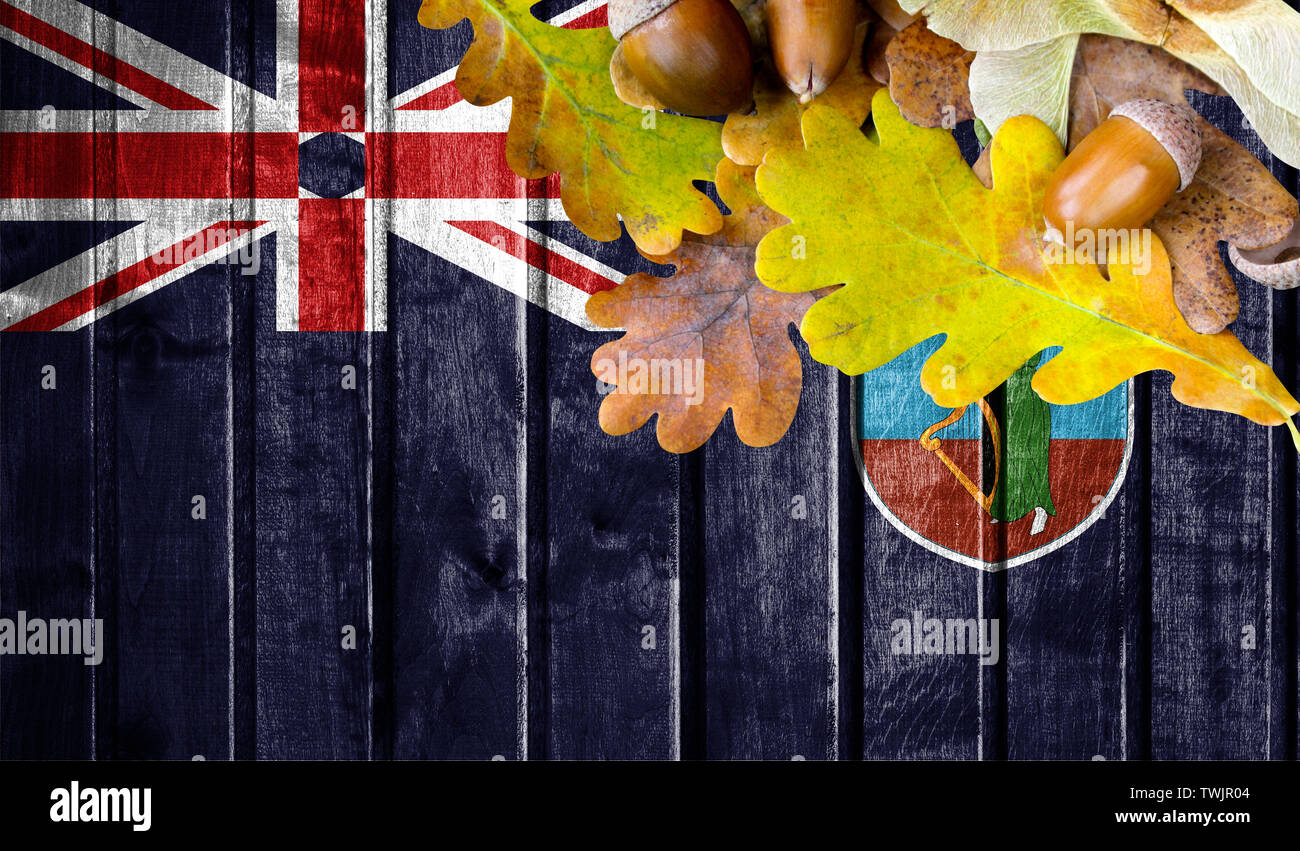 Montserrat flag on autumn wooden background with leaves and good place ...
