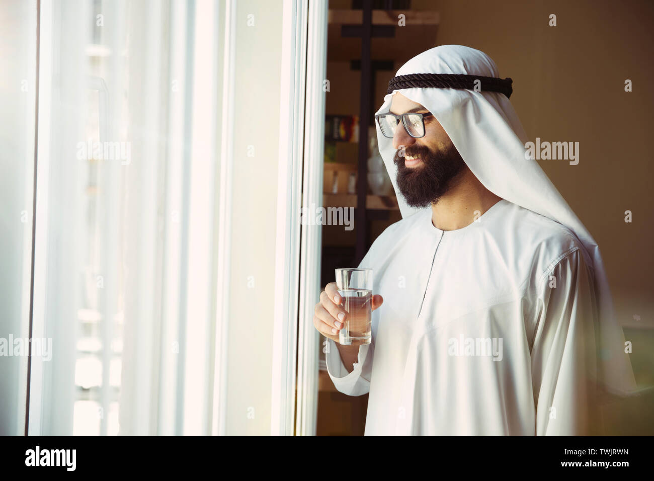 Arab saudi businessman working online with a laptop and tablet in his ...