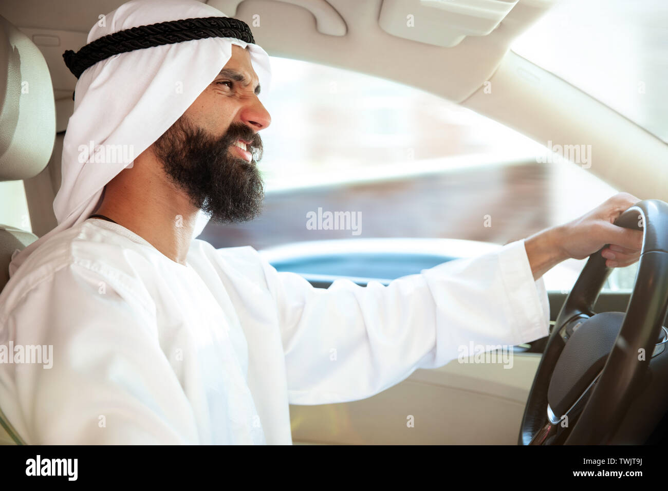 Emirati man driving hi-res stock photography and images - Alamy