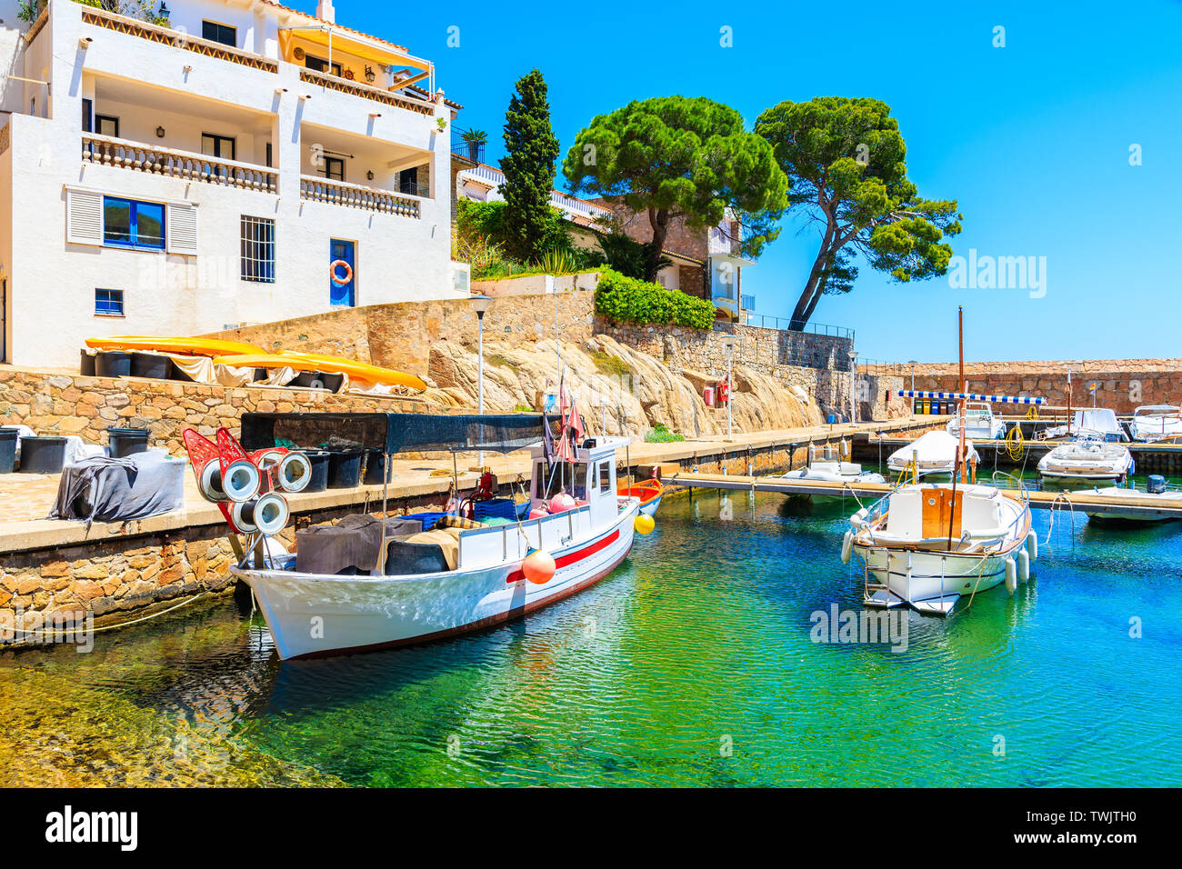 Fishing boats at fornells village hi-res stock photography and images ...