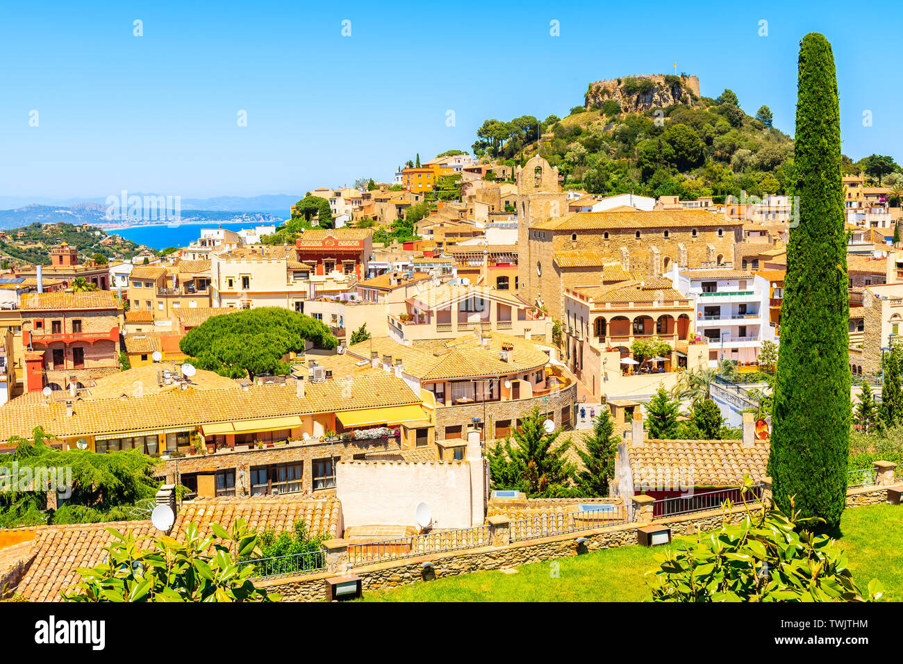 Traditional stone houses in Begur town, view from terrace in city ...