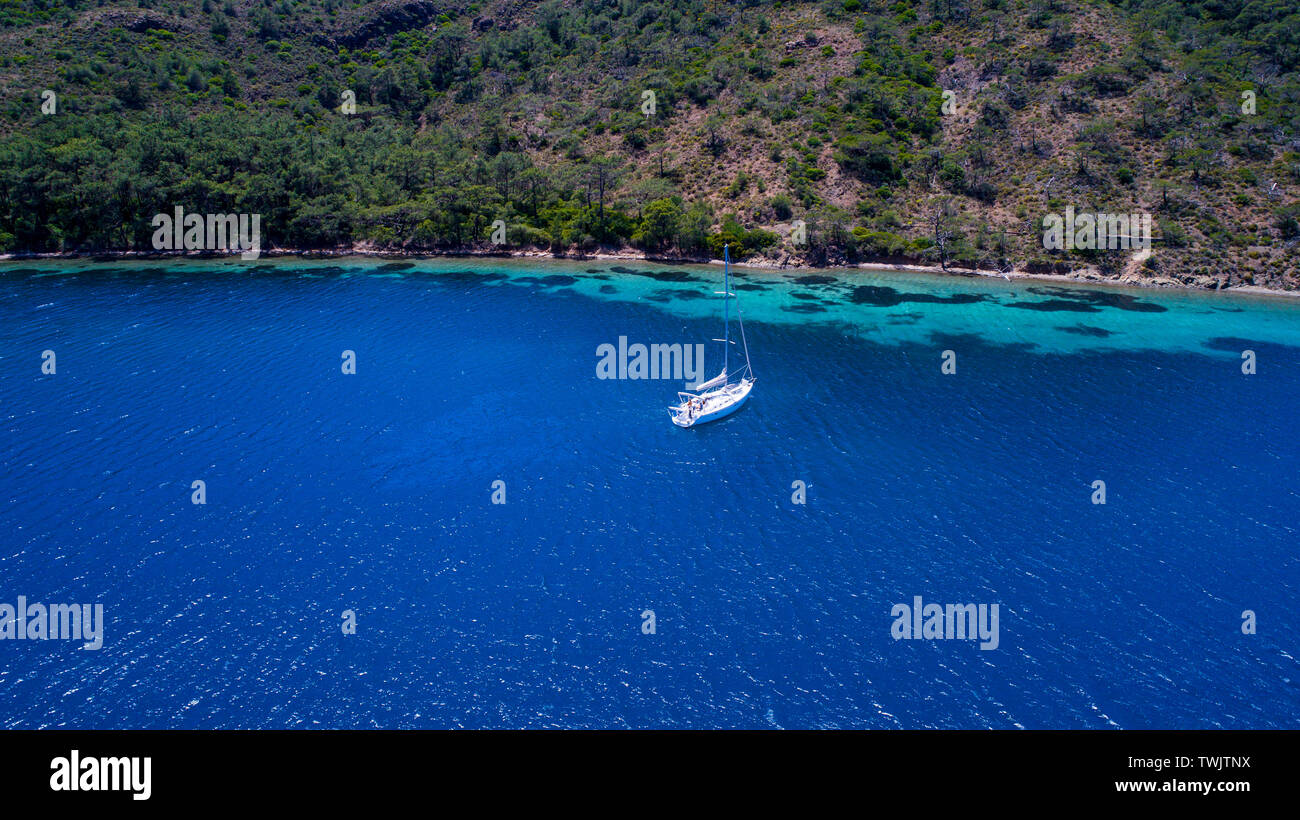 Aerial view of sea and yacht. Sailing ship in the middle of ocean, top ...
