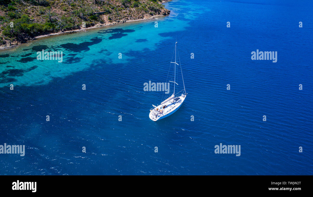 Aerial view of sea and yacht. Sailing ship in the middle of ocean, top ...