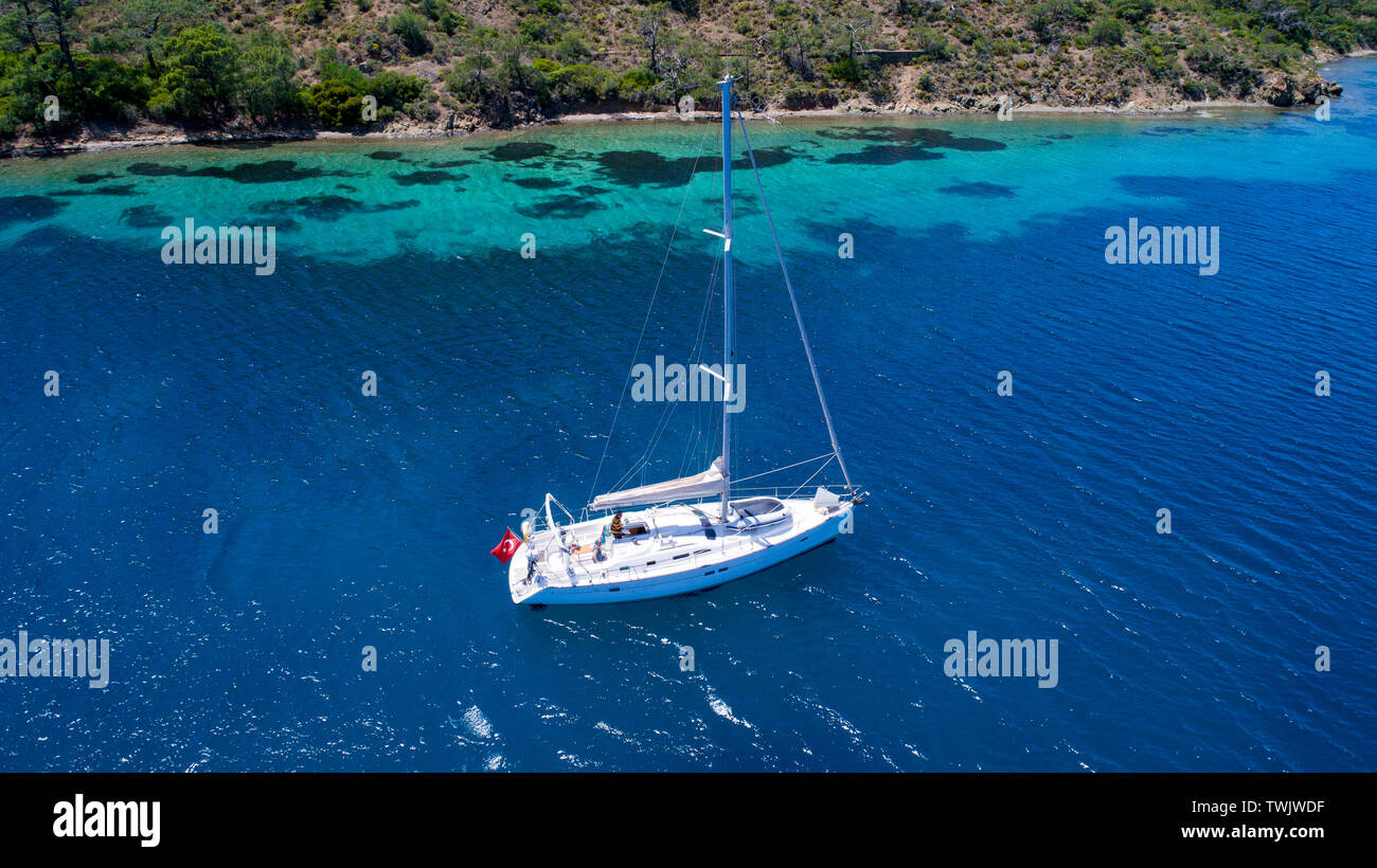 Aerial view of sea and yacht. Sailing ship in the middle of ocean, top ...