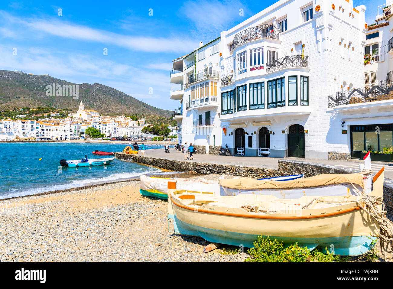 Fishing boats on beach in Cadaques white village, Costa Brava, Spain ...