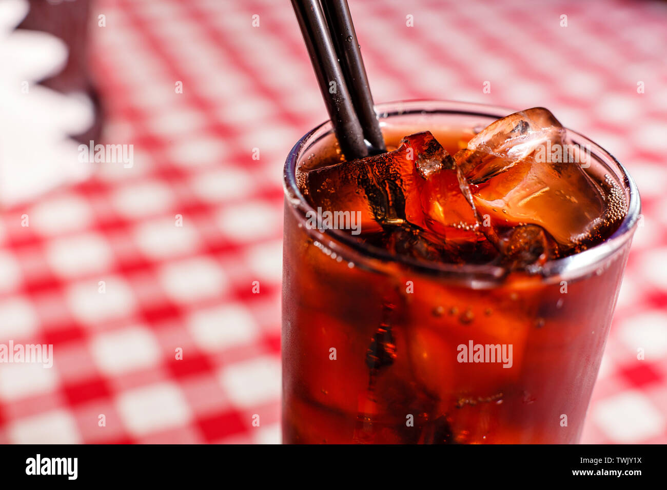 Cold drink beverage. Cola soda with ice and bubble on front view red ...
