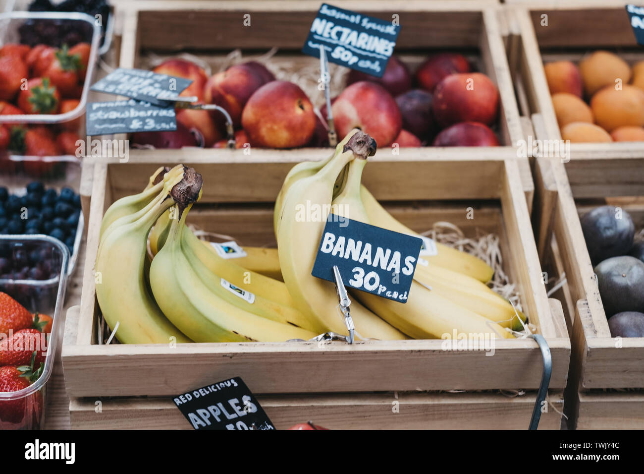 London, UK - June 15, 2019: Fresh fruits in wooden crates on sale at ...
