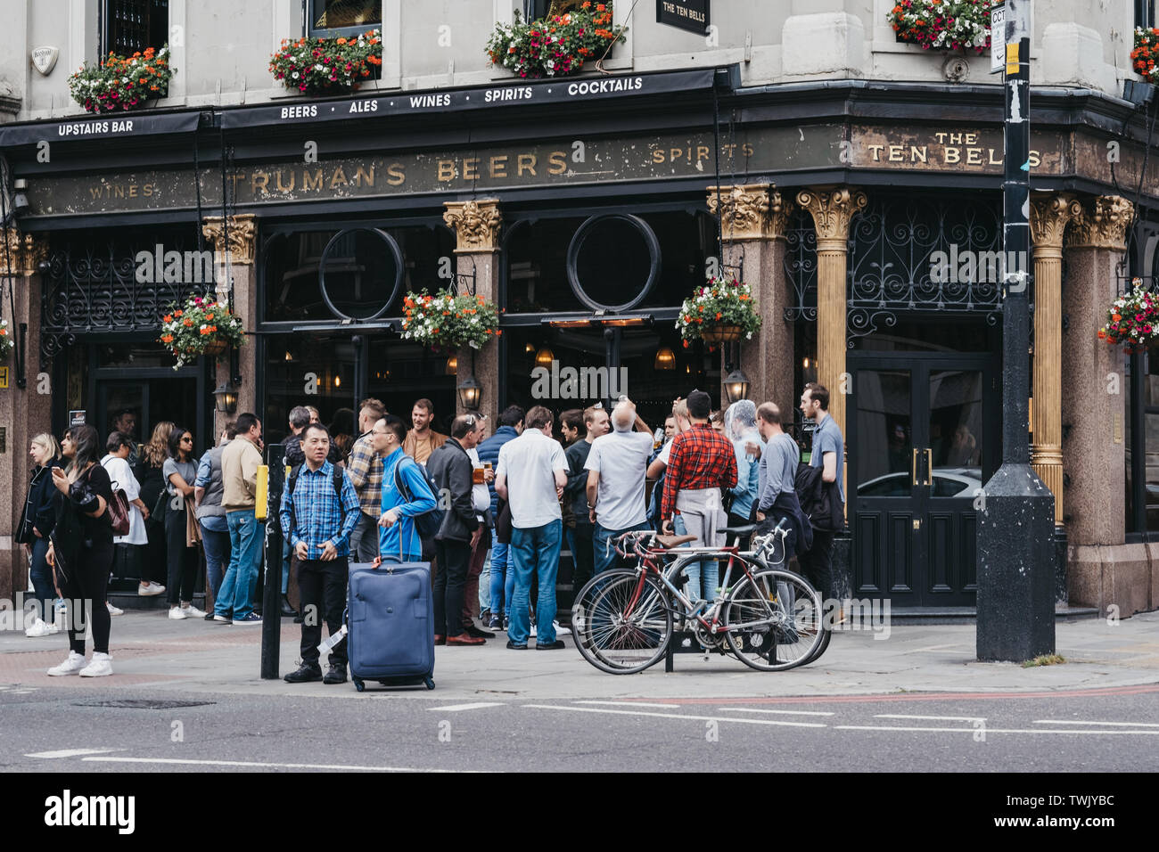 London, UK - June 15, 2019: People standing and drinking outside The ...