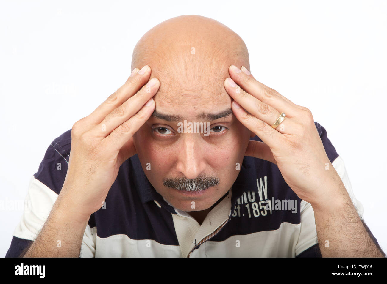 Portrait of a man with head in hands Stock Photo - Alamy
