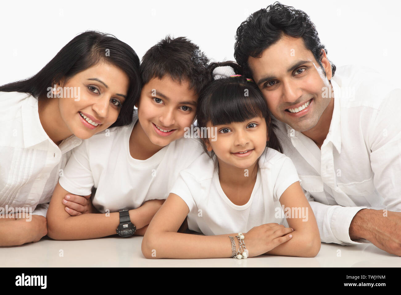 Family lying down and smiling Stock Photo - Alamy