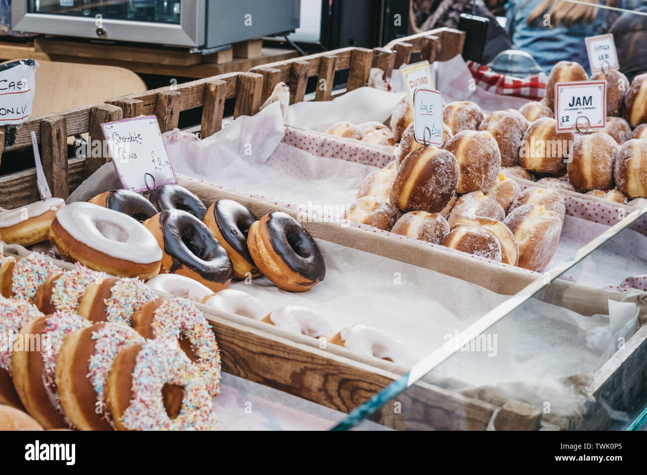 Variety of fresh doughnuts on sale at a food market in London, UK Stock ...
