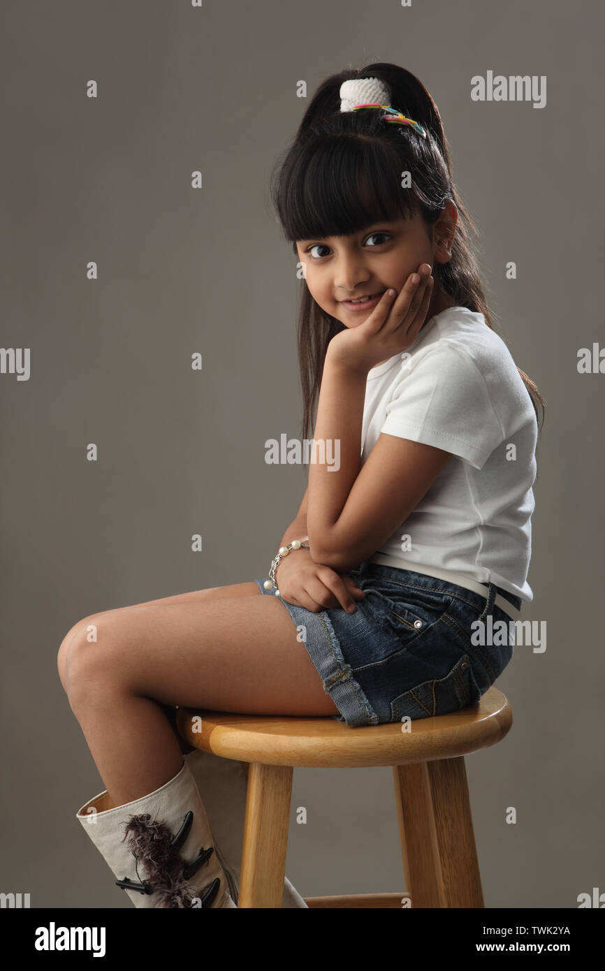 Girl on stool hi-res stock photography and images - Alamy