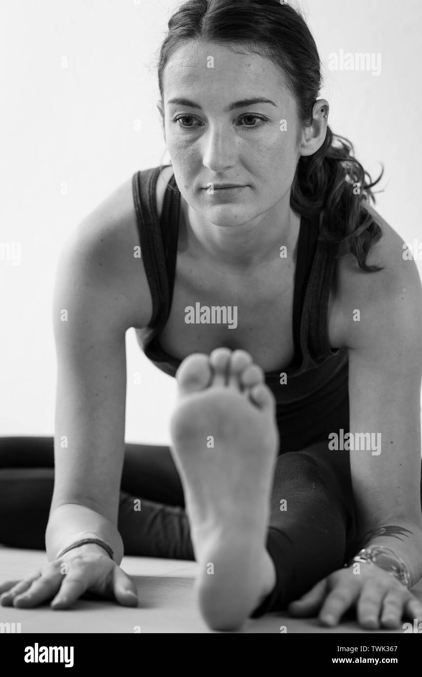 Seated stretch Black and White Stock Photos & Images - Alamy