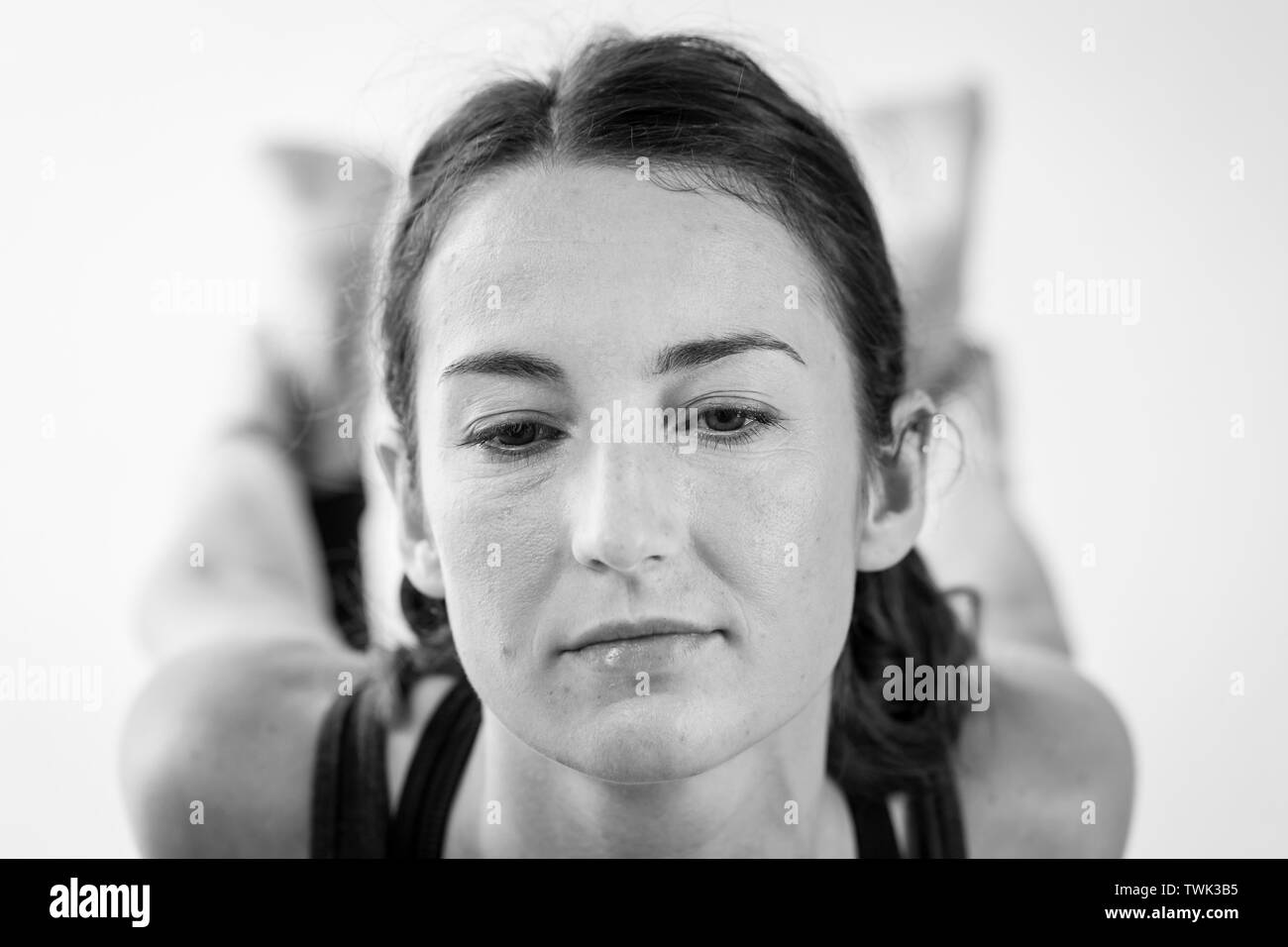 Attractive young European brunette female yogi practicing the ...