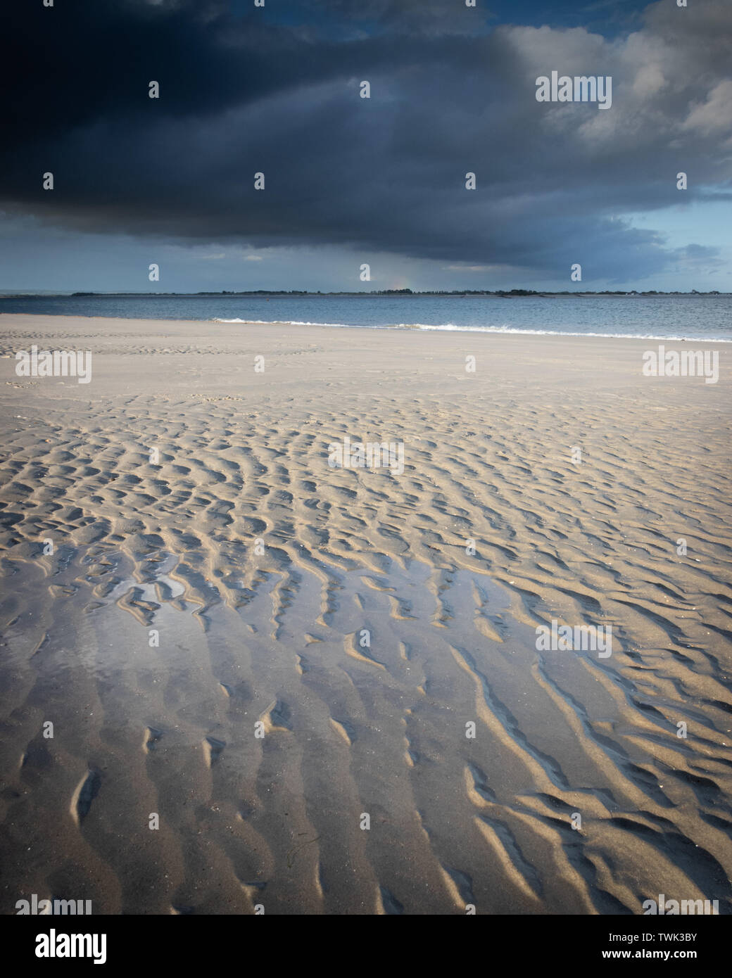 storm clouds over a sandy beach Stock Photo - Alamy