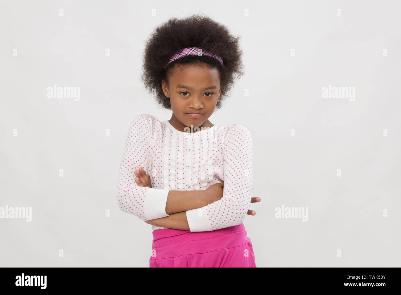 Portrait of a girl with arms crossed Stock Photo - Alamy