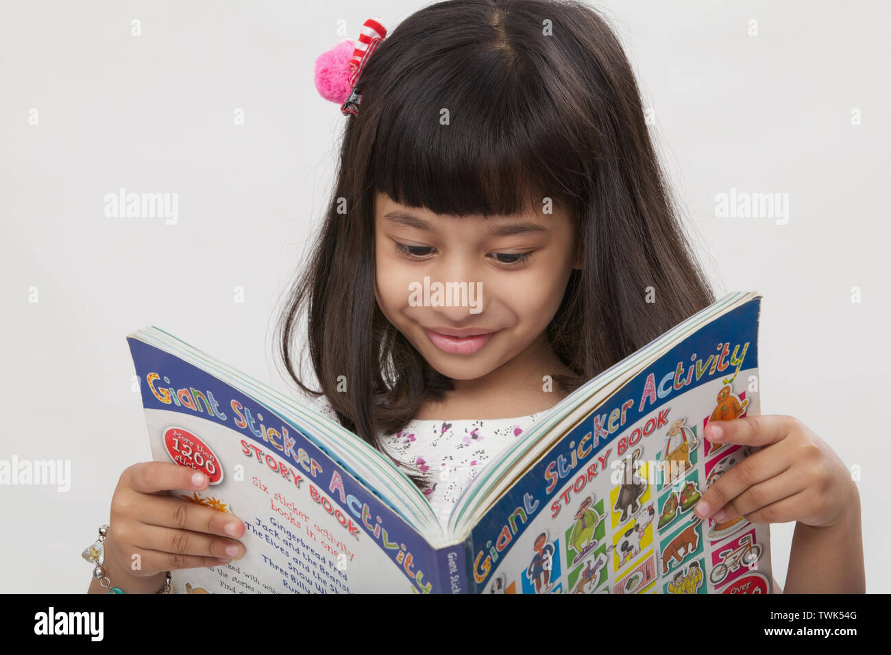 Girl reading a book Stock Photo - Alamy