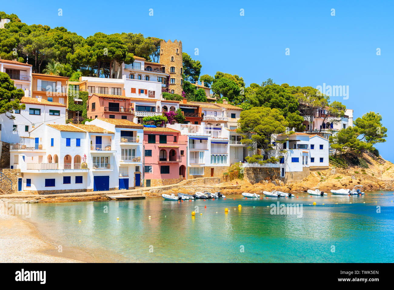 View of colorful houses in sea bay with beach in Sa Tuna coastal ...