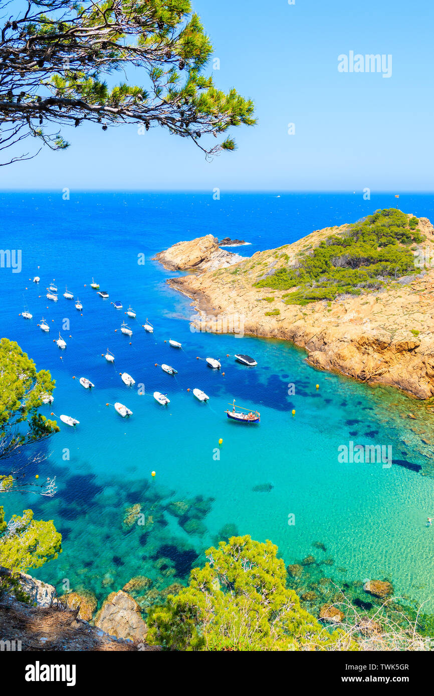 Boats in beautiful sea bay with beach near Sa Tuna village, Costa Brava ...