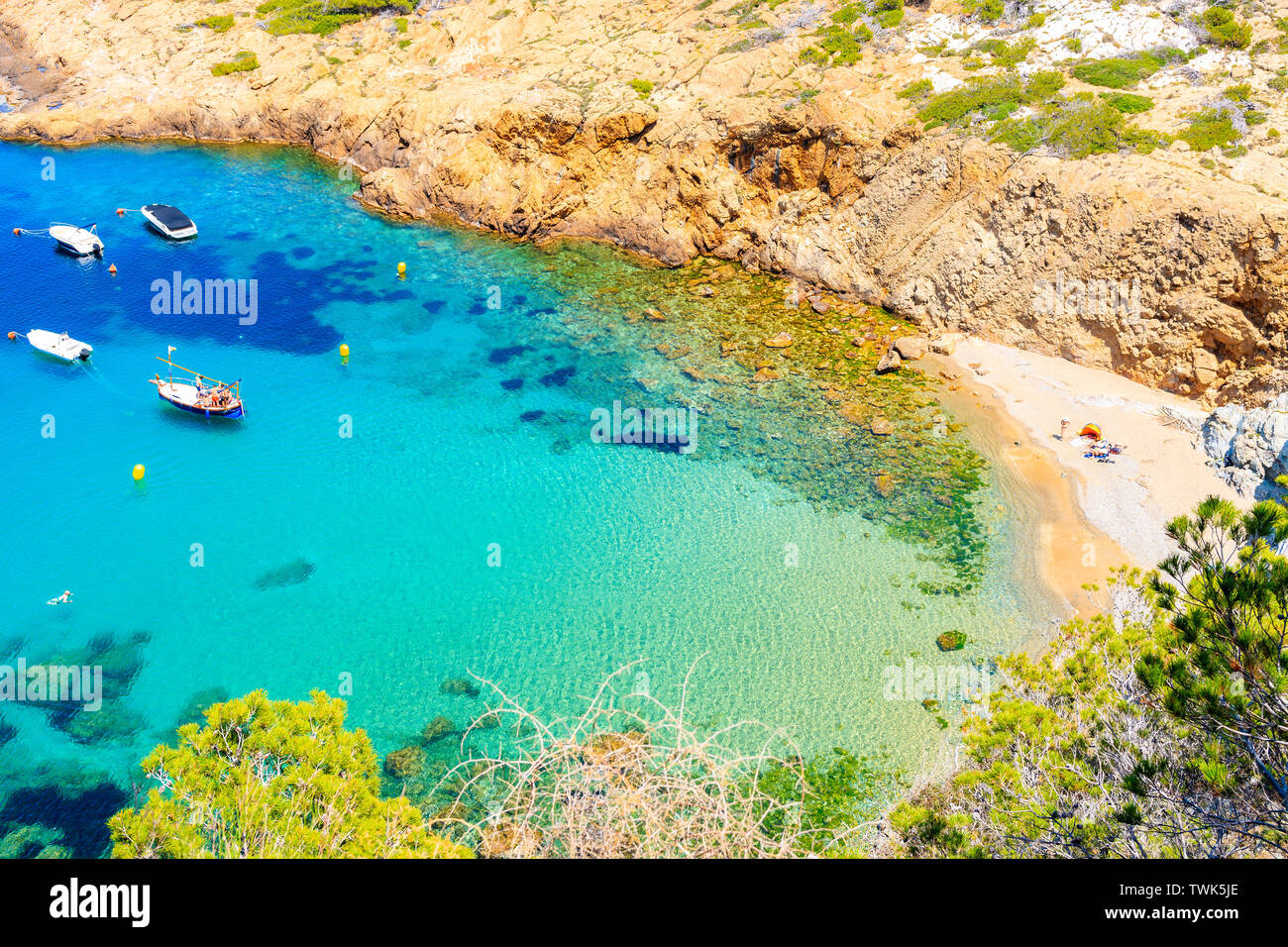 Boats in beautiful sea bay with beach near Sa Tuna village, Costa Brava ...
