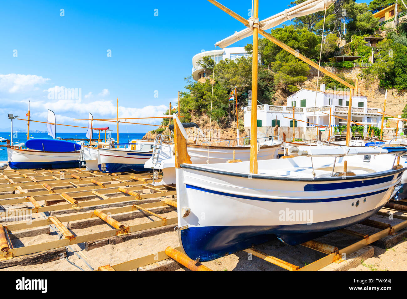 Traditional white and blue colour fishing boat on Sa Riera beach with ...