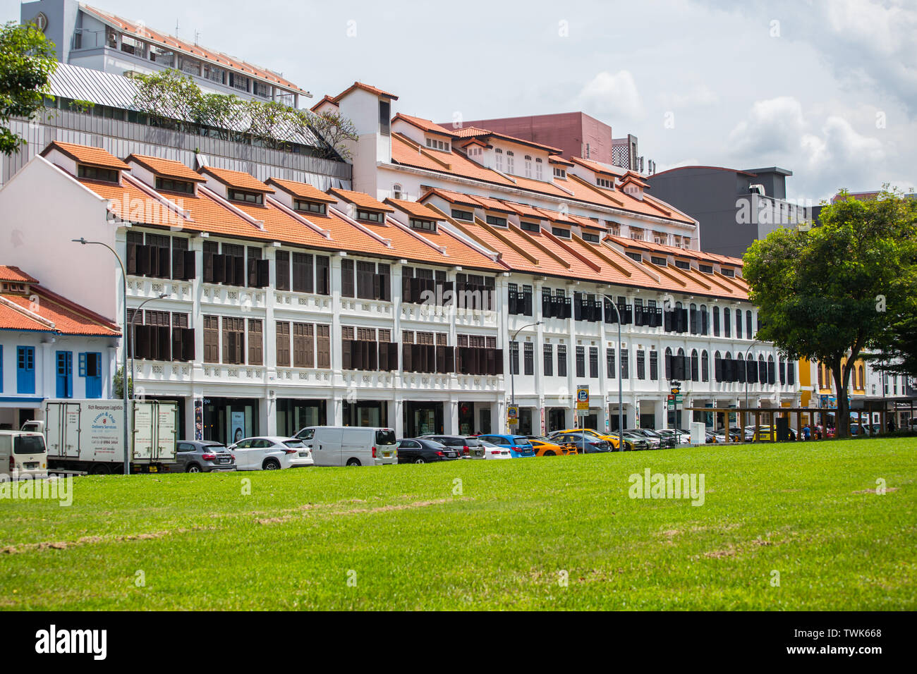 A neat row of three storey white colour traditional shophouses at Tan ...