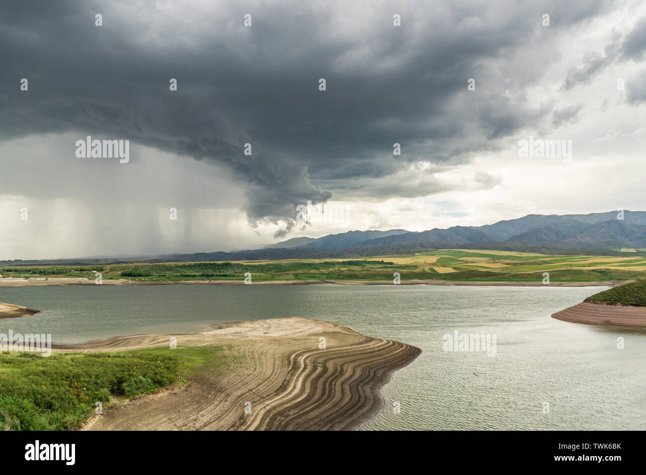 Hillside prairie villages under cloudy clouds Stock Photo - Alamy