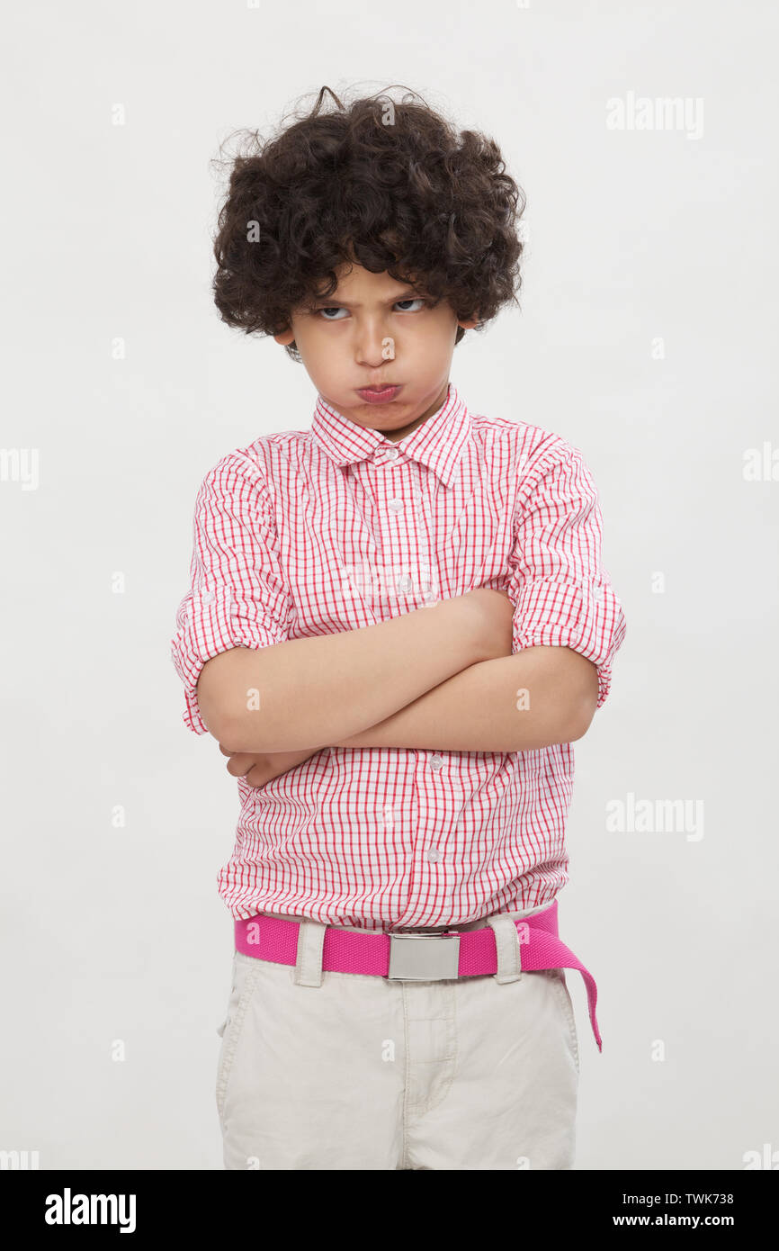 Boy standing with arms crossed Stock Photo - Alamy