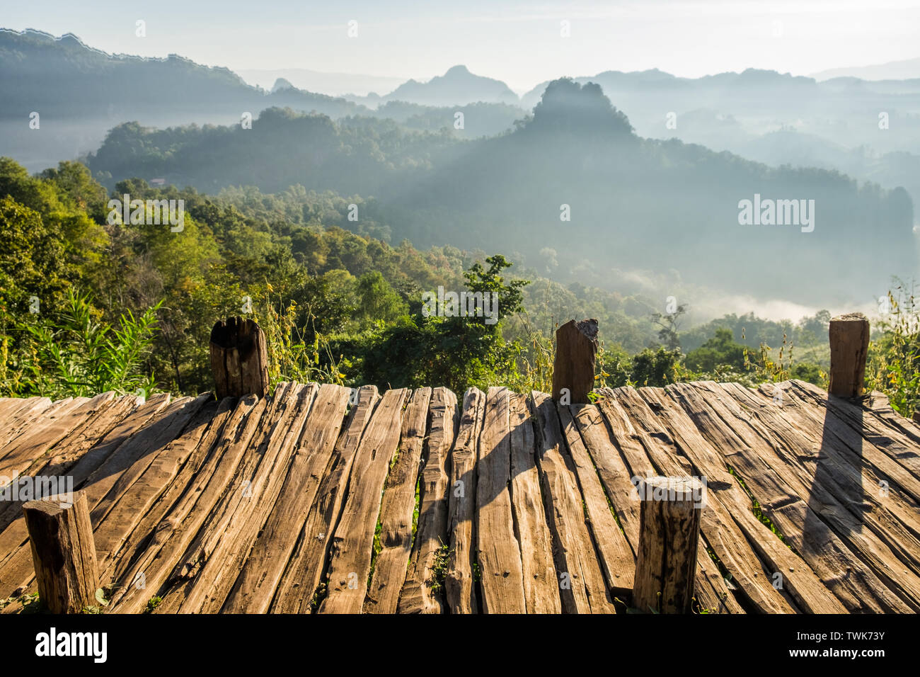 Viewpoint wood terrace with fog mountain in morning Stock Photo - Alamy