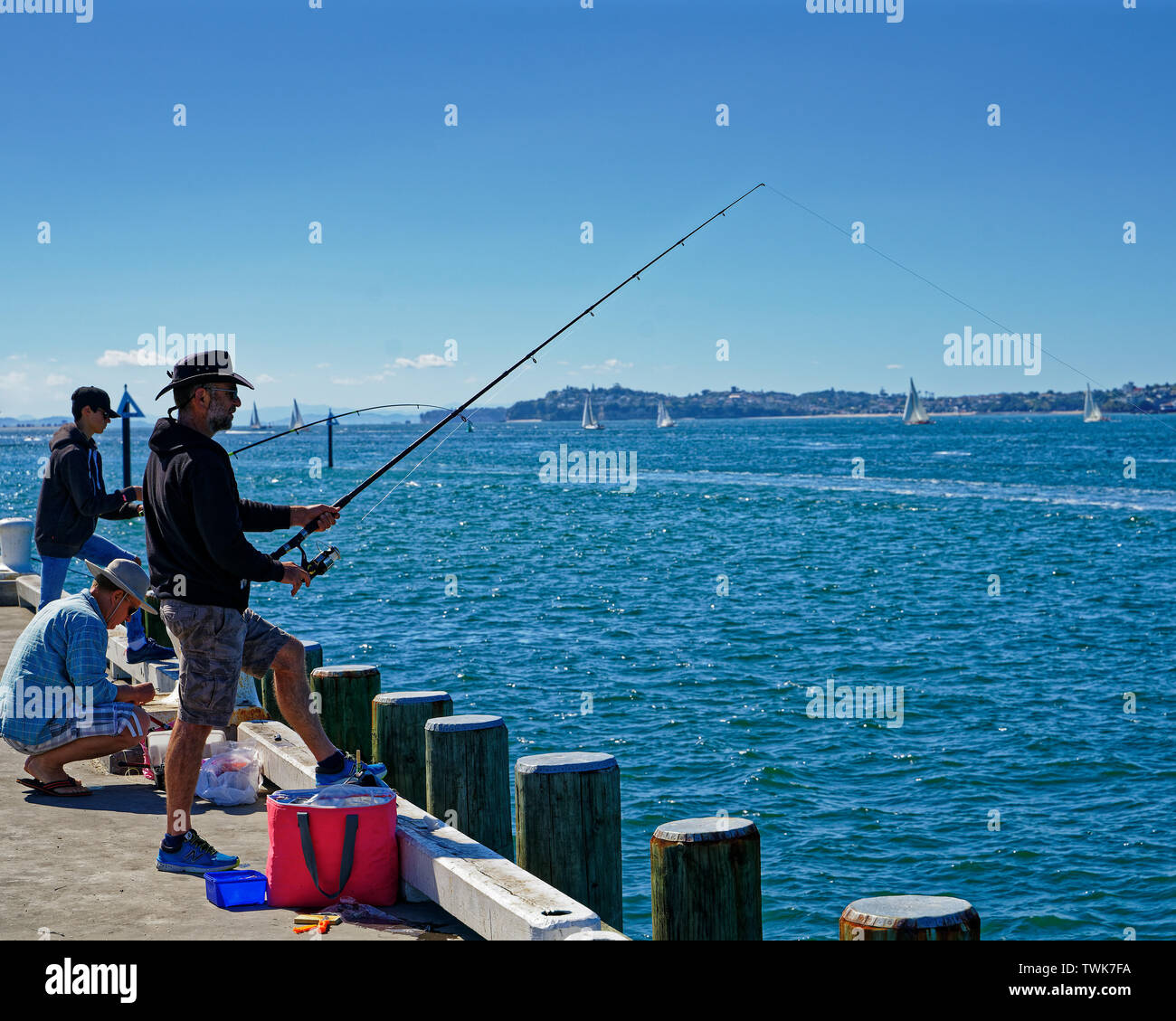 Fishing off the wharf hi-res stock photography and images - Alamy