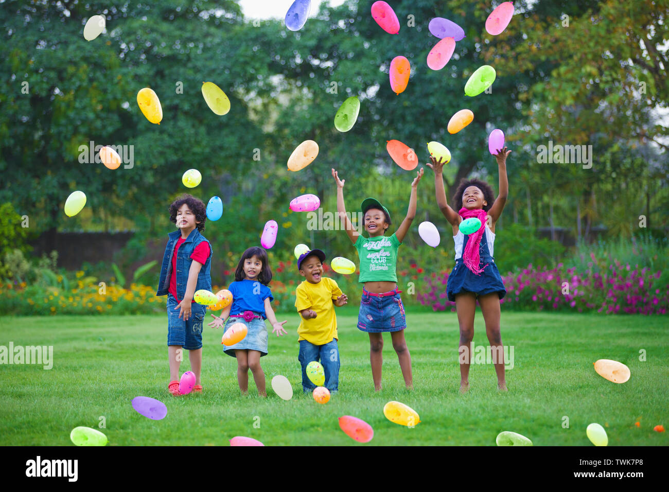 Children playing with balloons Stock Photo - Alamy