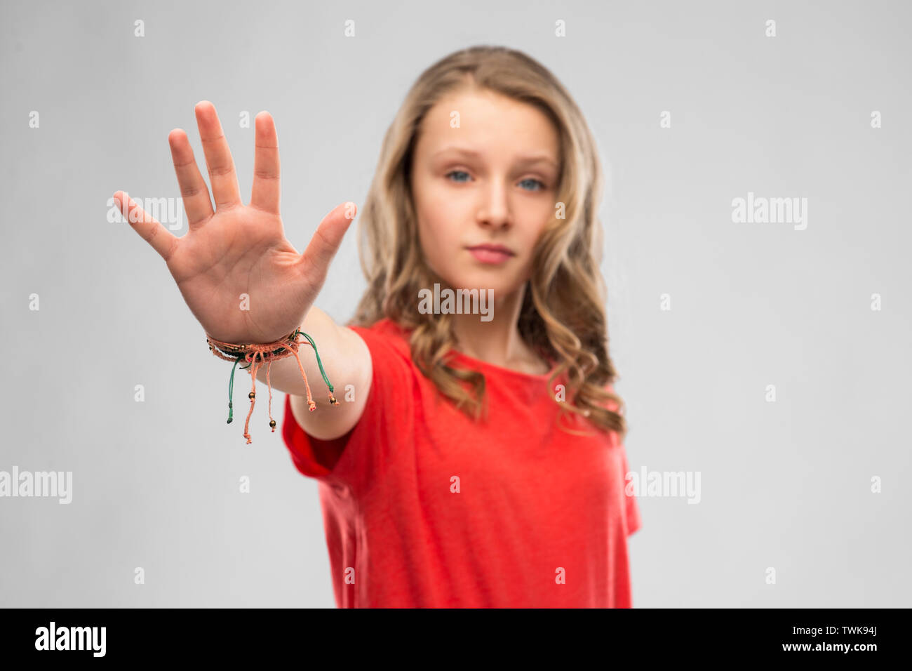 serious teenage girl showing stop gesture Stock Photo - Alamy