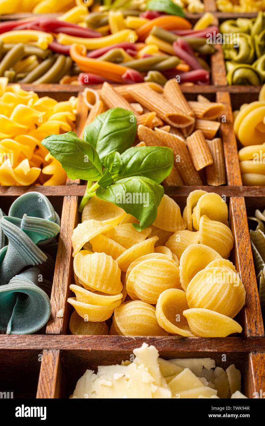 Assorted colorful italian pasta in wooden box Stock Photo - Alamy