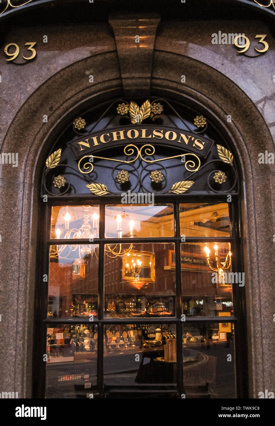 Looking through a window into a typical English pub in London. London ...