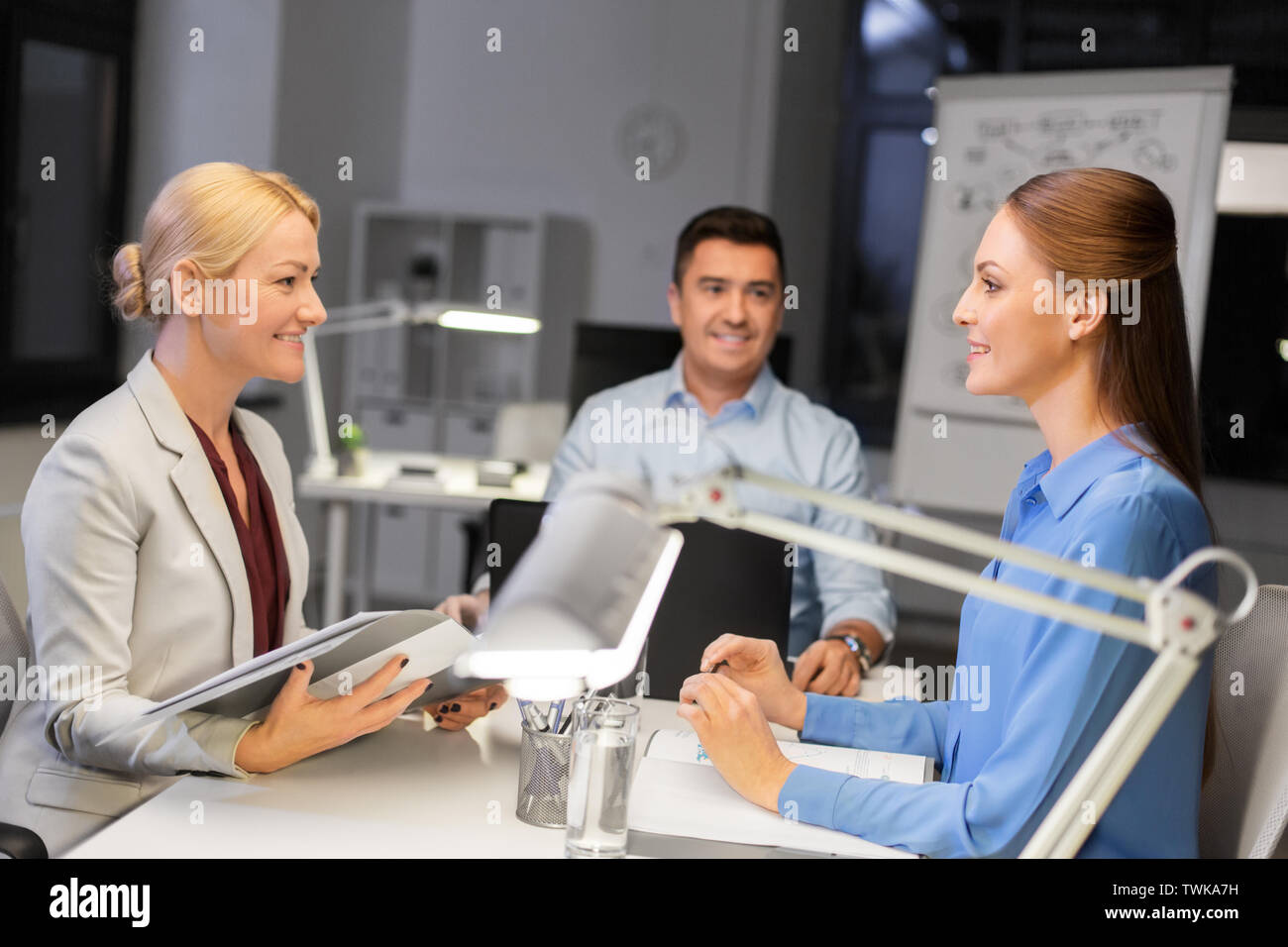 business team with laptop working late at office Stock Photo - Alamy