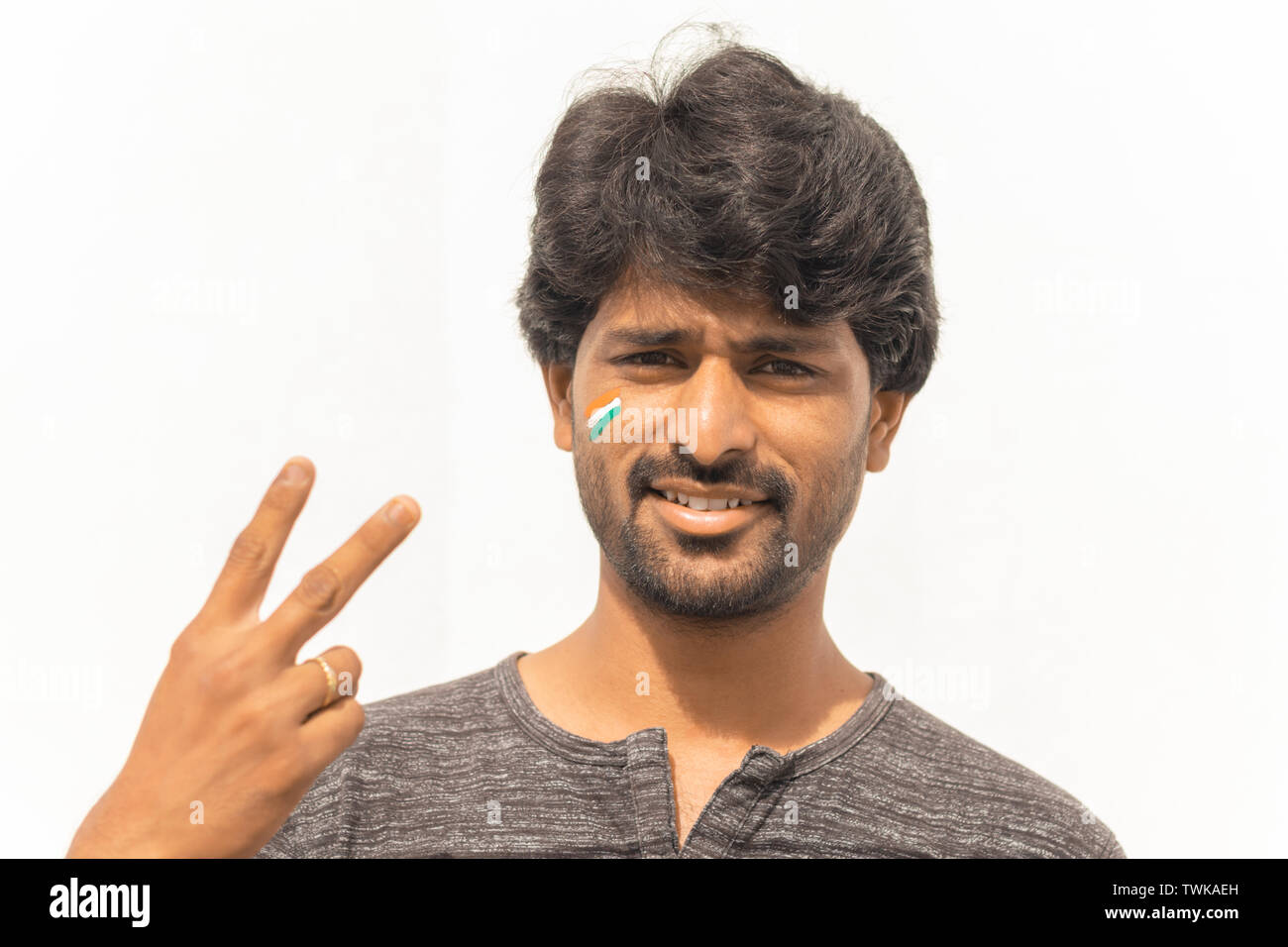 Portrait of Young cheerful Indian male Cricket sports fan Painted ...