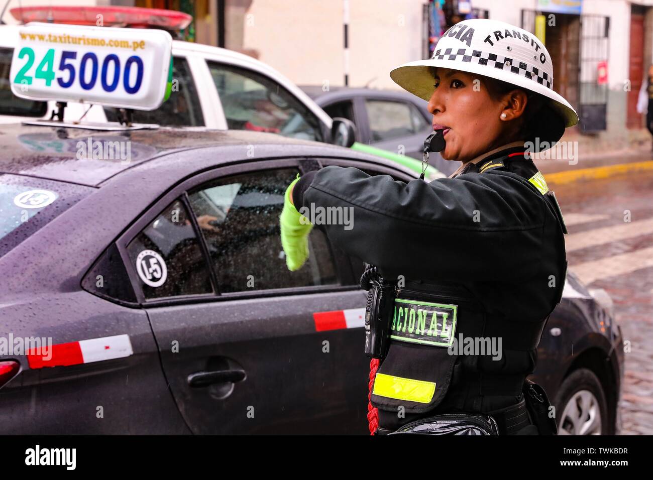 Cusco, Peru. 02nd May, 2019. Police officer with pipe in his mouth ...