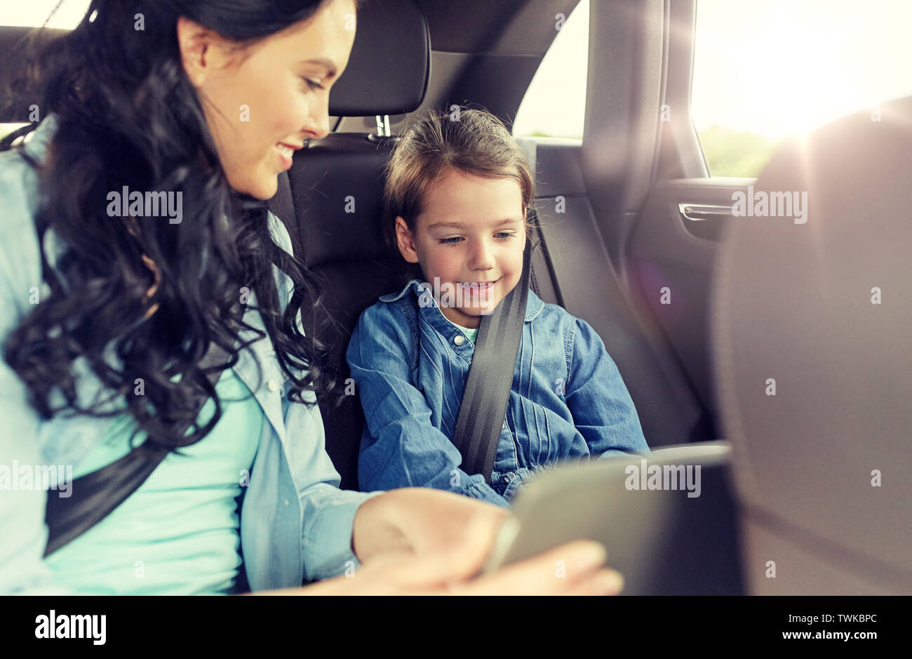 happy family with tablet pc driving in car Stock Photo - Alamy