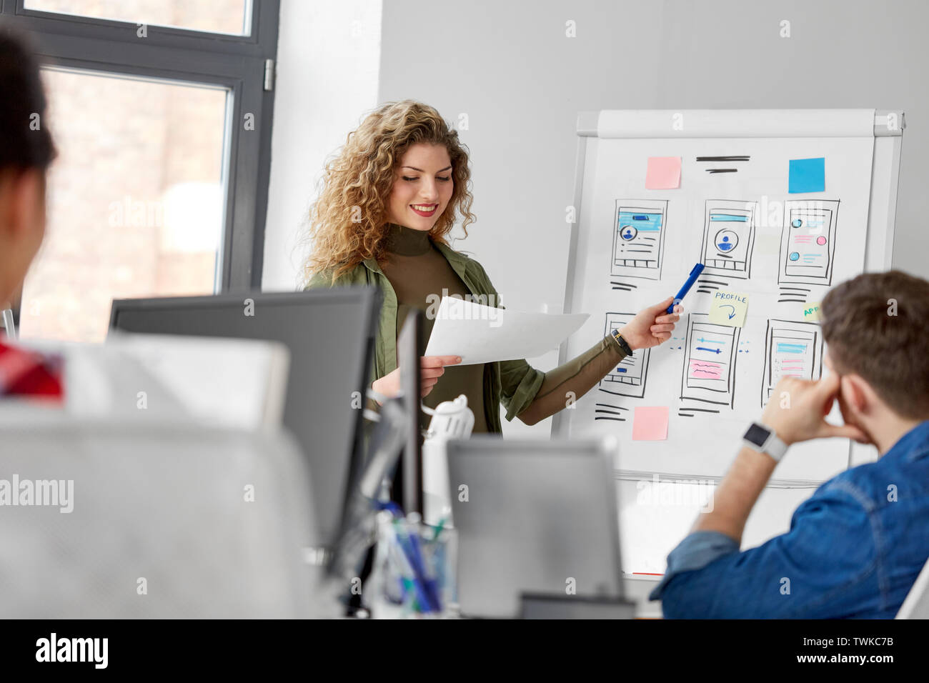 creative woman showing user interface at office Stock Photo - Alamy