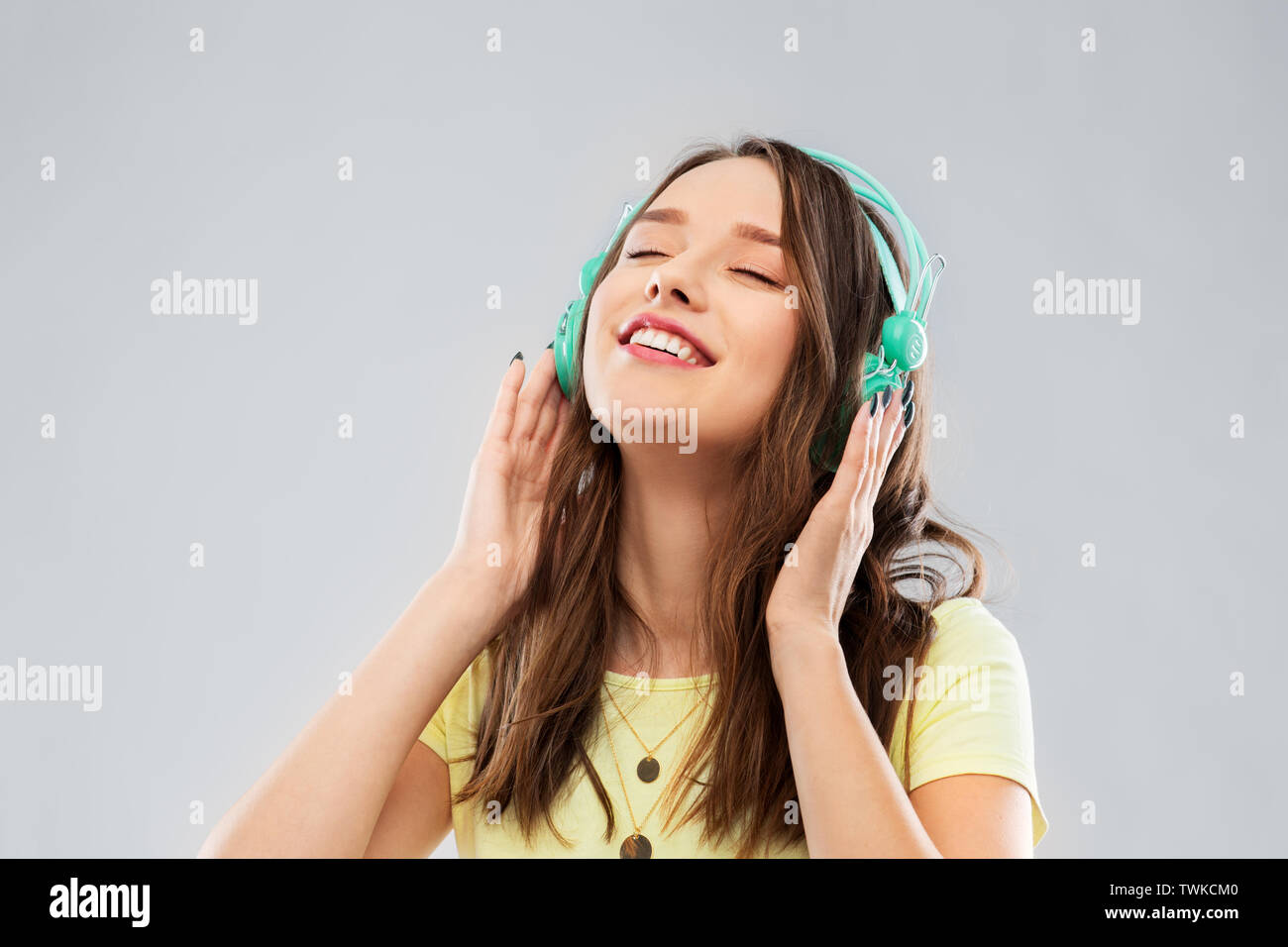 happy young woman or teenage girl with headphones Stock Photo - Alamy