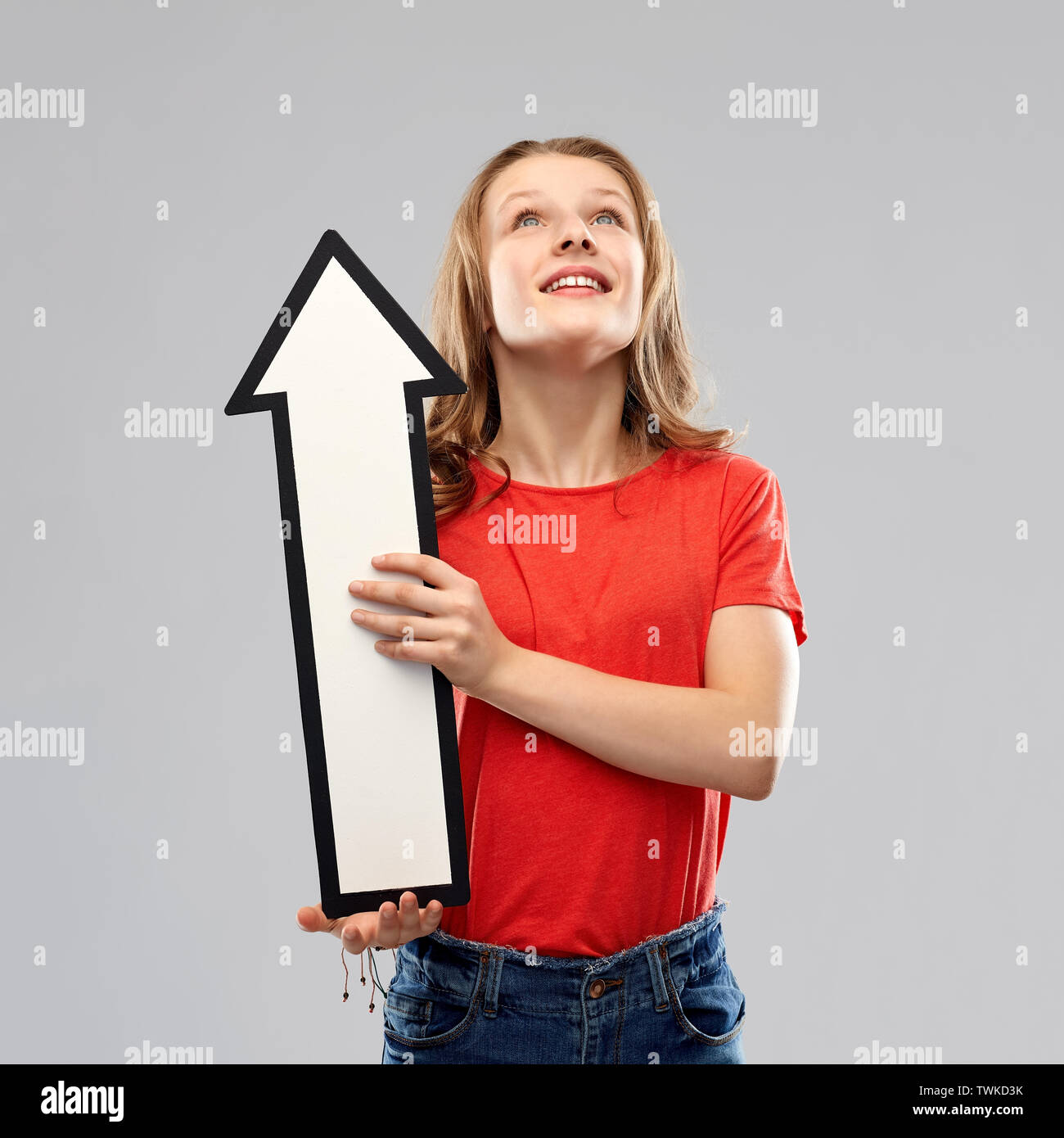 smiling teenage girl with arrow showing direction Stock Photo - Alamy