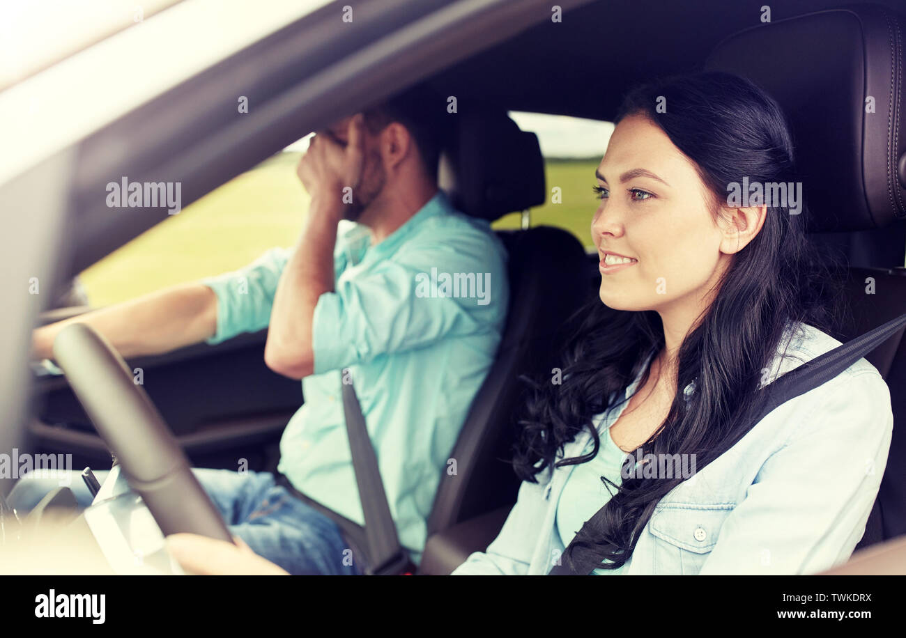 woman driving car and man covering face with palm Stock Photo - Alamy
