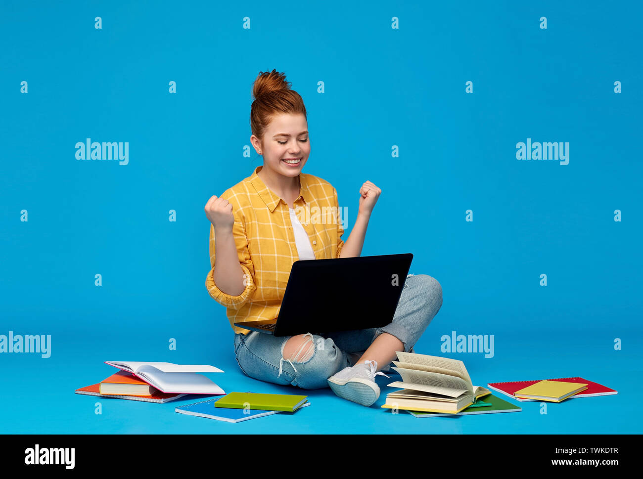 happy student girl with laptop celebrating success Stock Photo - Alamy