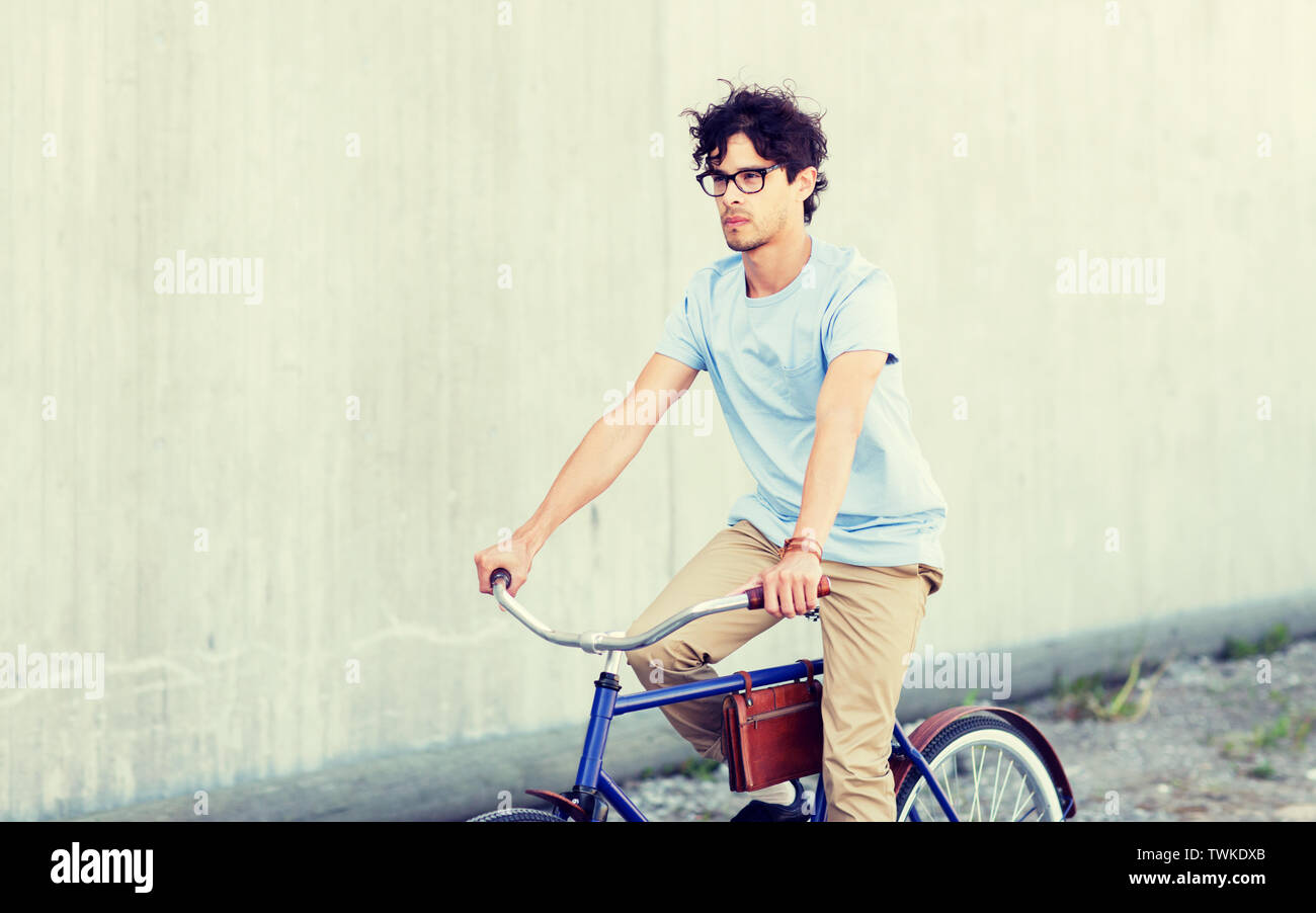 young hipster man riding fixed gear bike Stock Photo - Alamy
