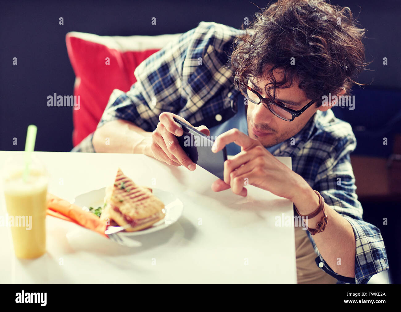 man with smartphone photographing food at cafe Stock Photo - Alamy