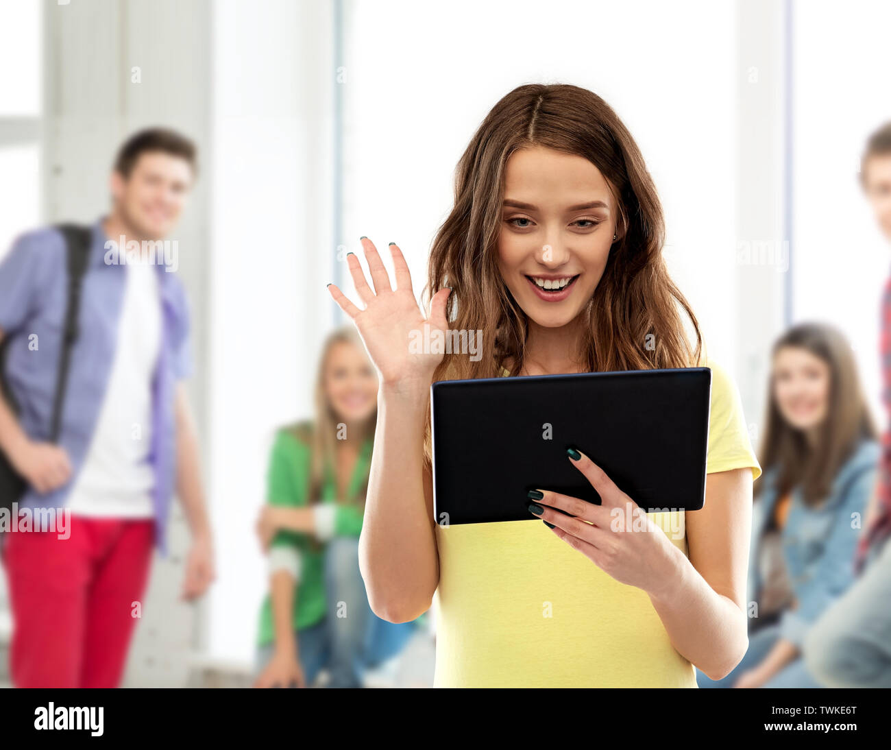 teenage girl having video call on tablet computer Stock Photo - Alamy